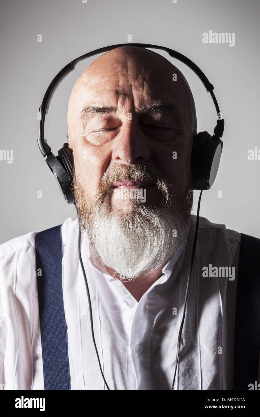 an old man listening to music Stock Photo - Alamy