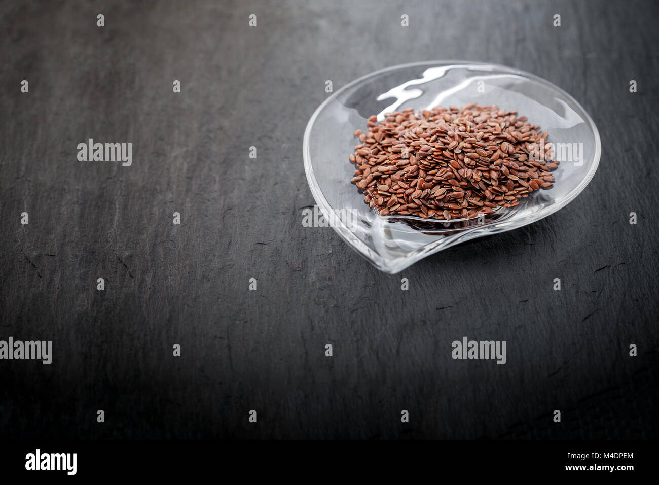 Flax seed in glass bowl Stock Photo - Alamy