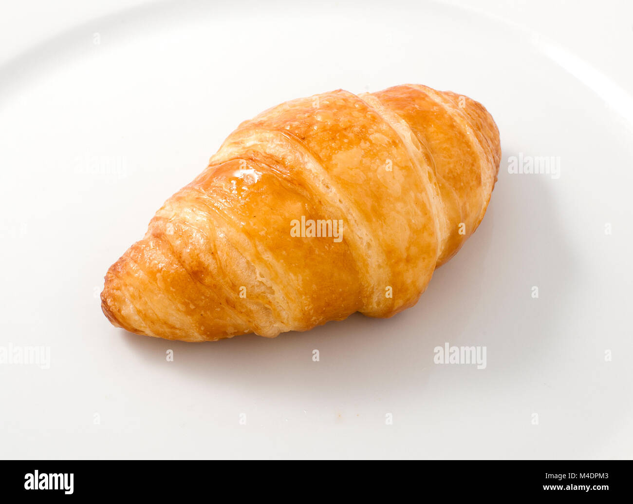 Plain croissant isolated on white Stock Photo - Alamy