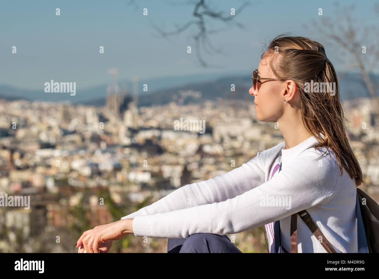 Woman overlooking Barcelona cityscape from Montjuic Stock Photo - Alamy