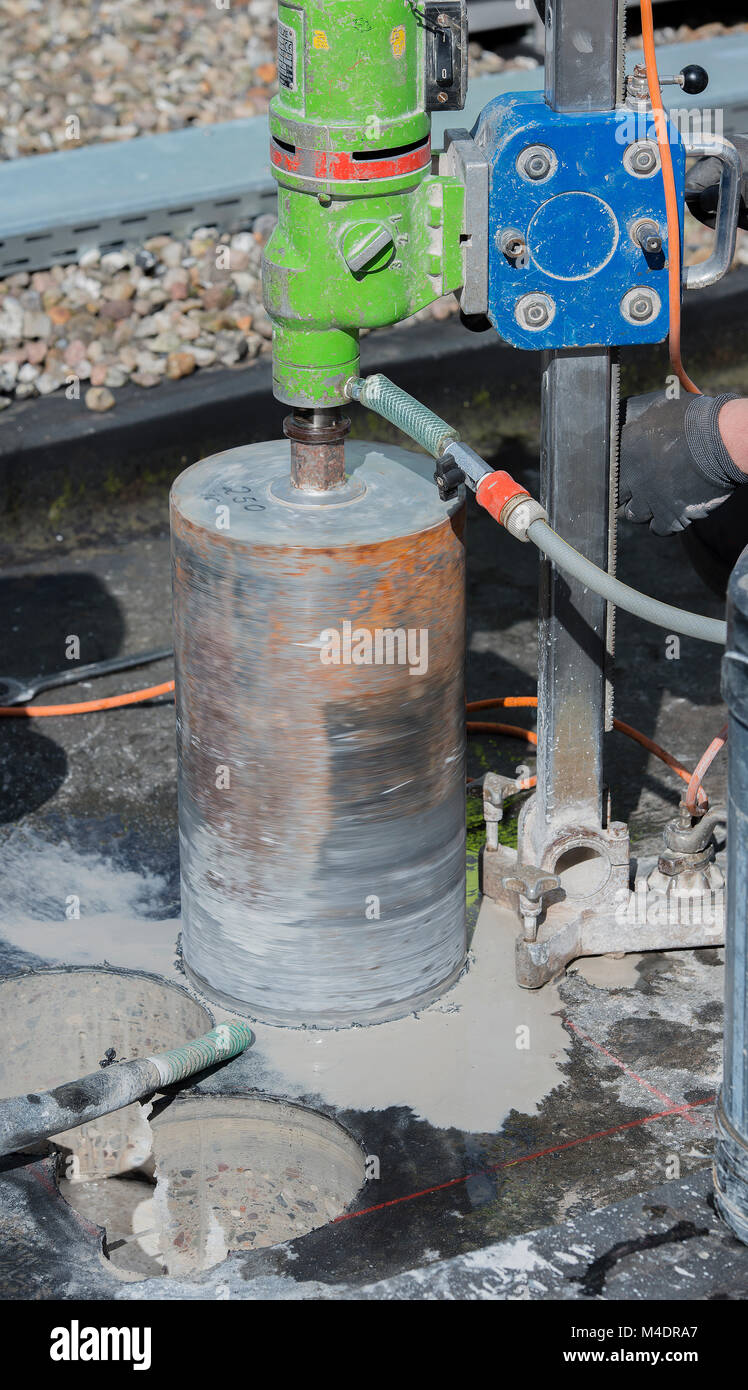 Core drilling through a building ceiling Stock Photo - Alamy