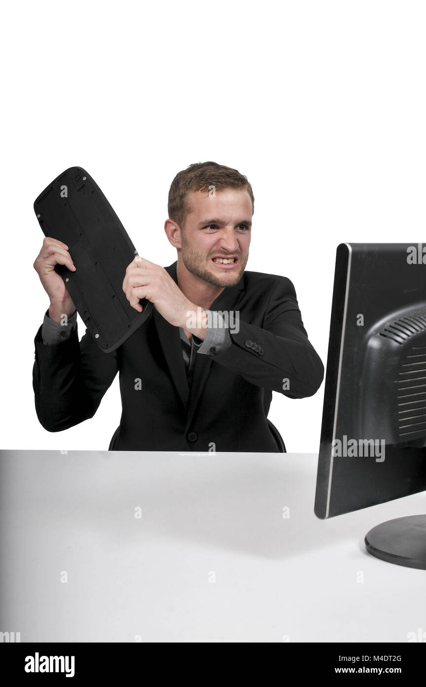 Angry Man Using Computer Stock Photo - Alamy