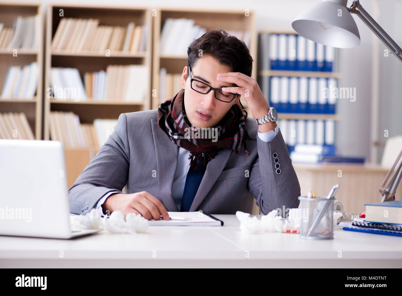 Sick ill businessman laptop blowing hi-res stock photography and images ...