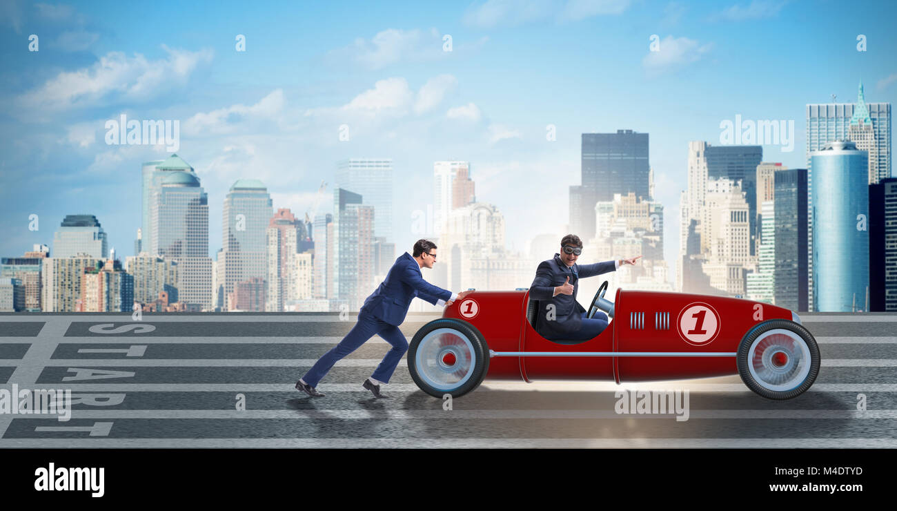 Businessman car pushing in teamwork concept Stock Photo - Alamy