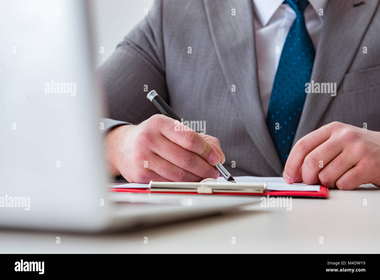 Businessman taking notes at the meeting Stock Photo - Alamy