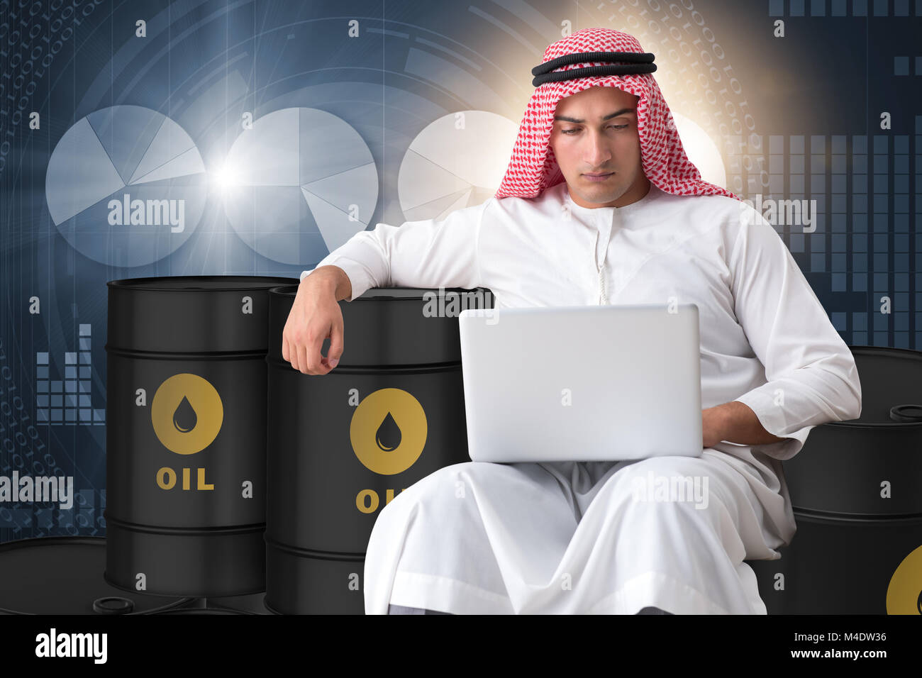 Arab businessman trading crude oil on laptop Stock Photo - Alamy