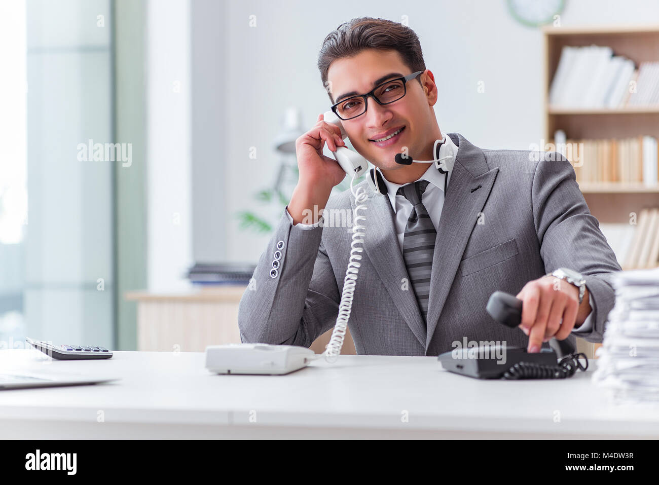 Call center operator talking on the phone Stock Photo - Alamy