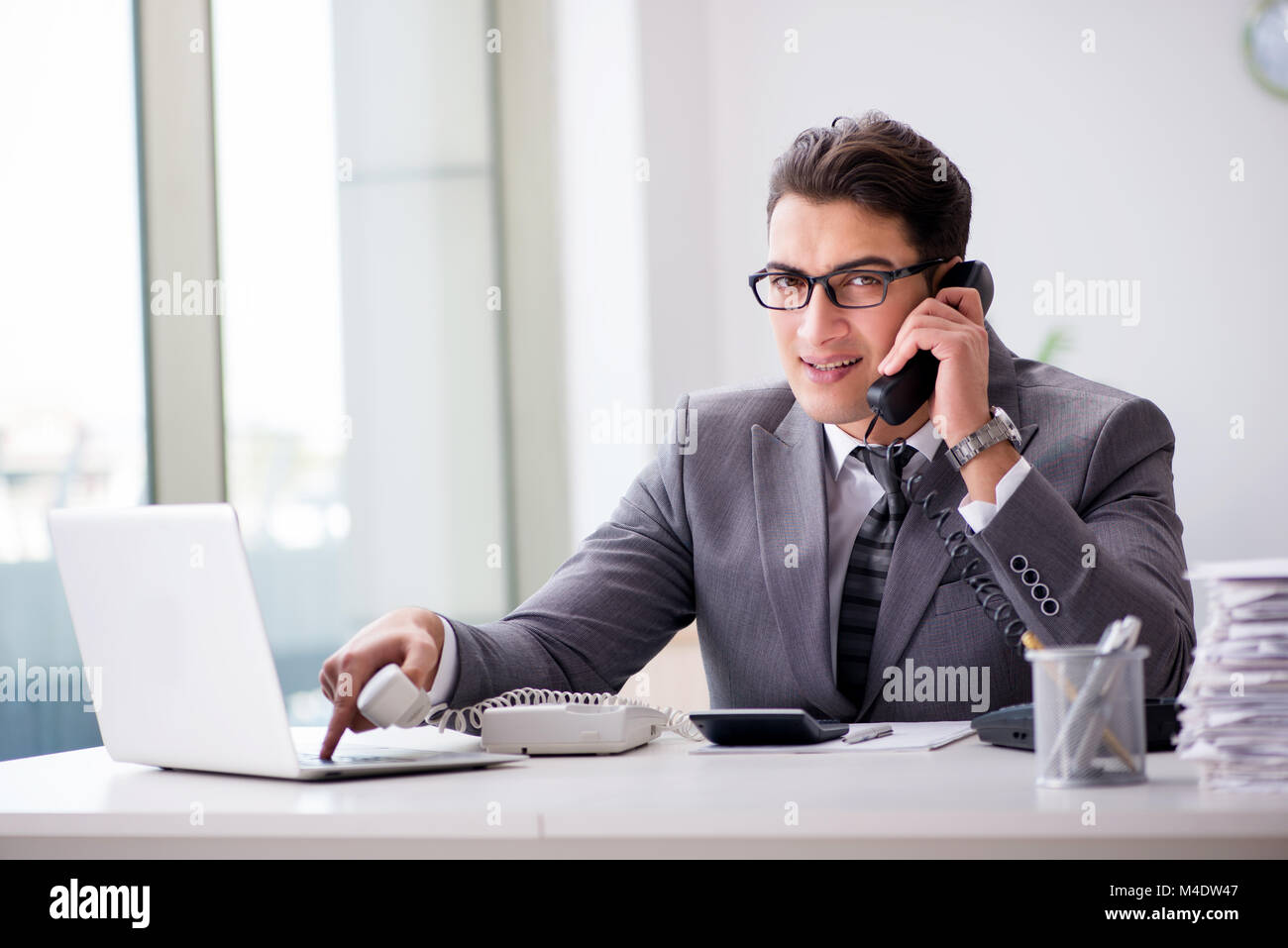 Angry helpdesk operator yelling in office Stock Photo - Alamy