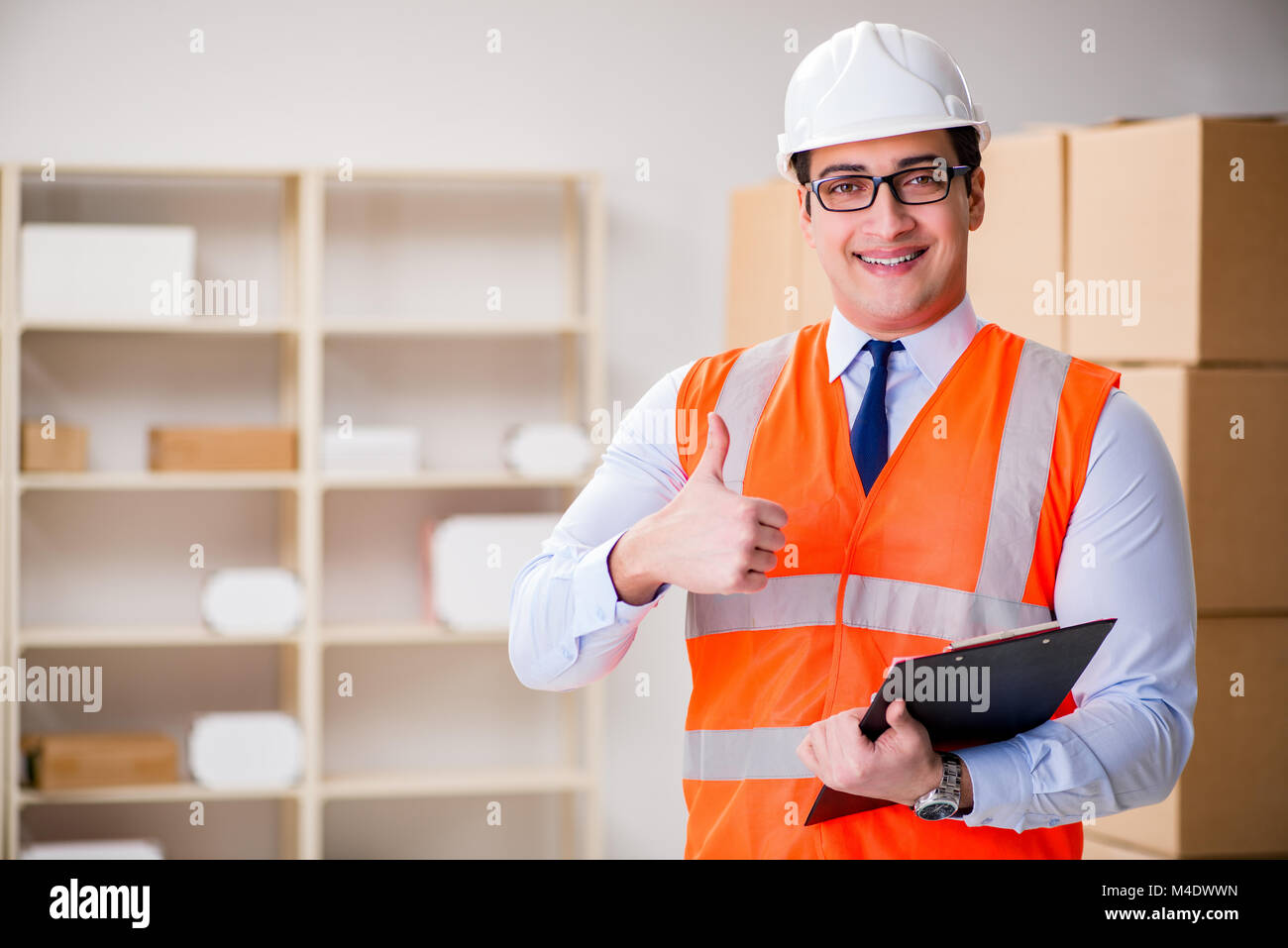 Man working in postal parcel delivery service office Stock Photo - Alamy