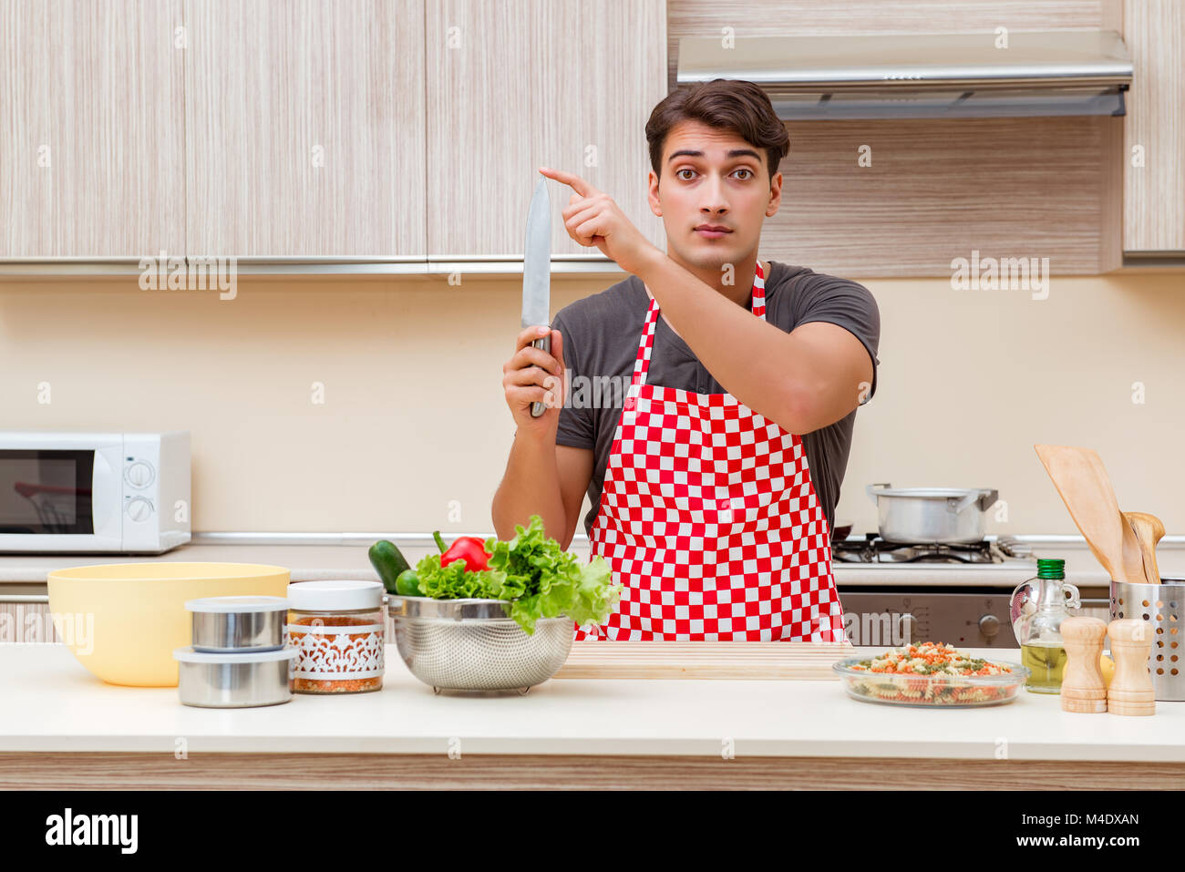 Man male cook preparing food in kitchen Stock Photo - Alamy