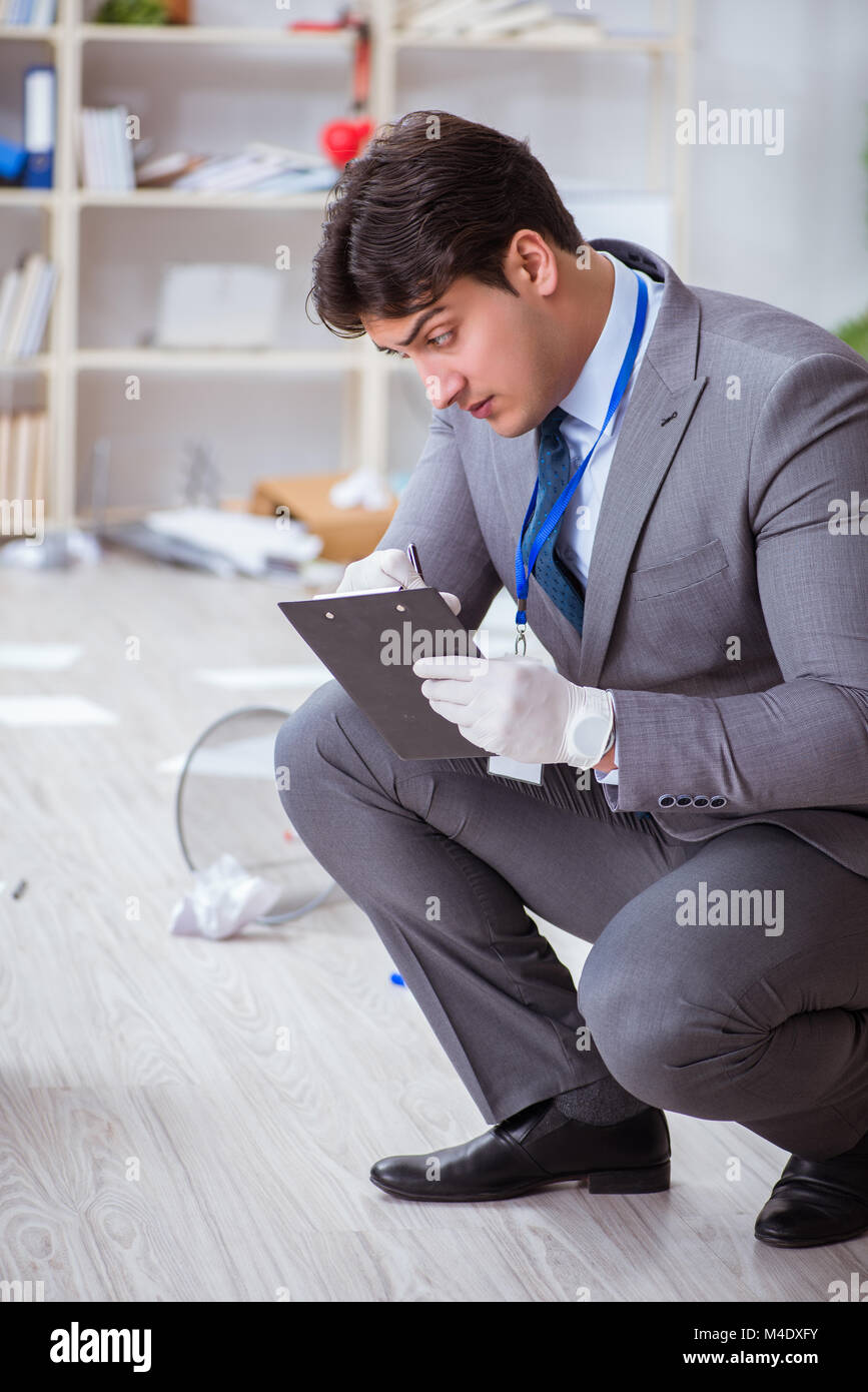 Young man during crime investigation in office Stock Photo - Alamy