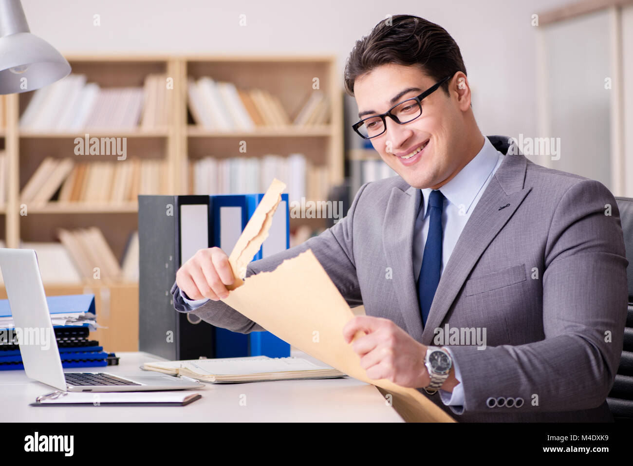 Businessman receiving letter in the office Stock Photo - Alamy