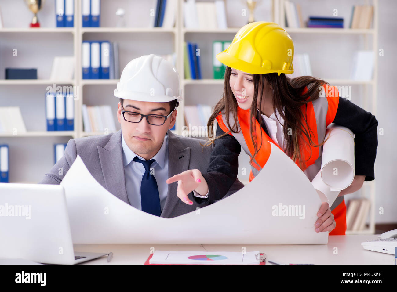 Reviewing architectural drawings hi-res stock photography and images ...