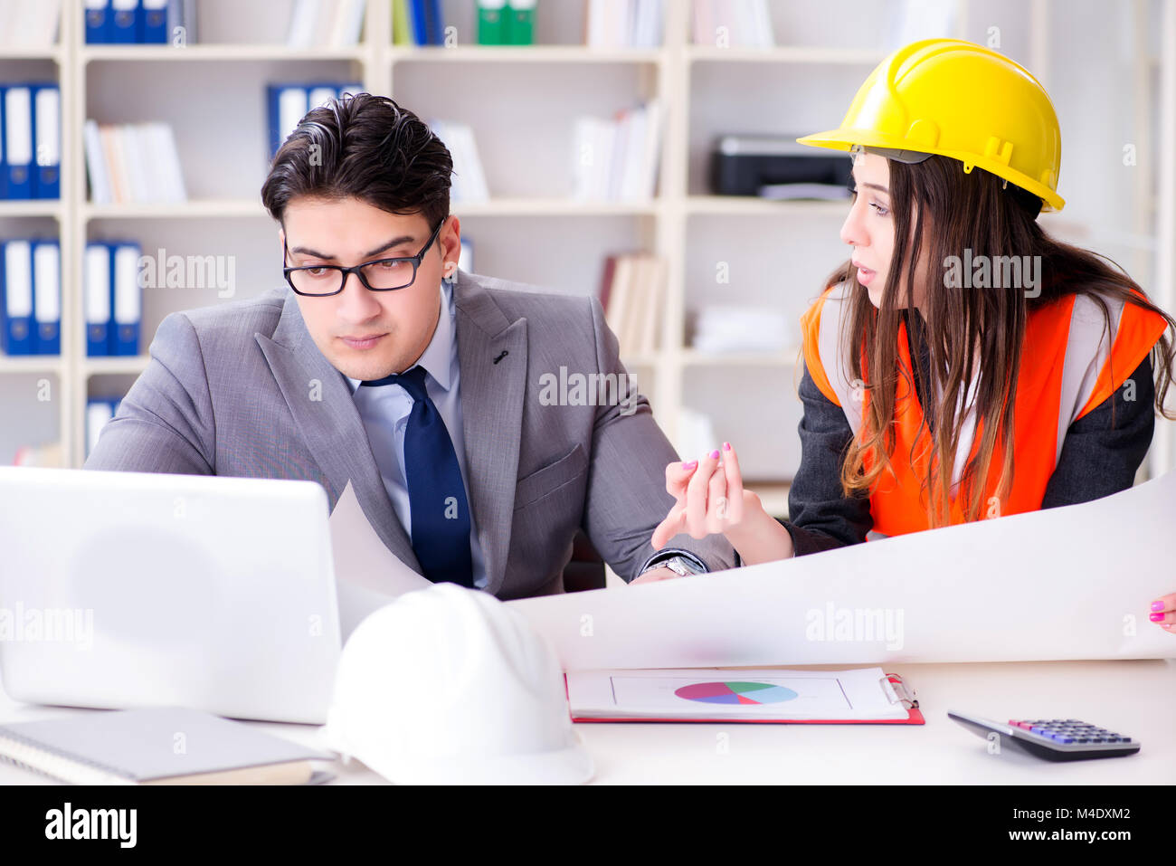 Reviewing architectural drawings hi-res stock photography and images ...