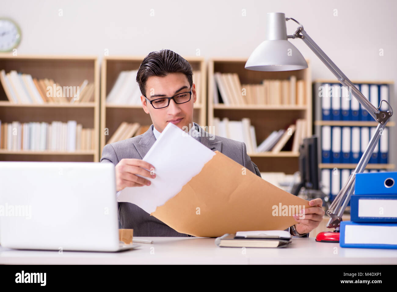 Businessman receiving letter in the office Stock Photo - Alamy
