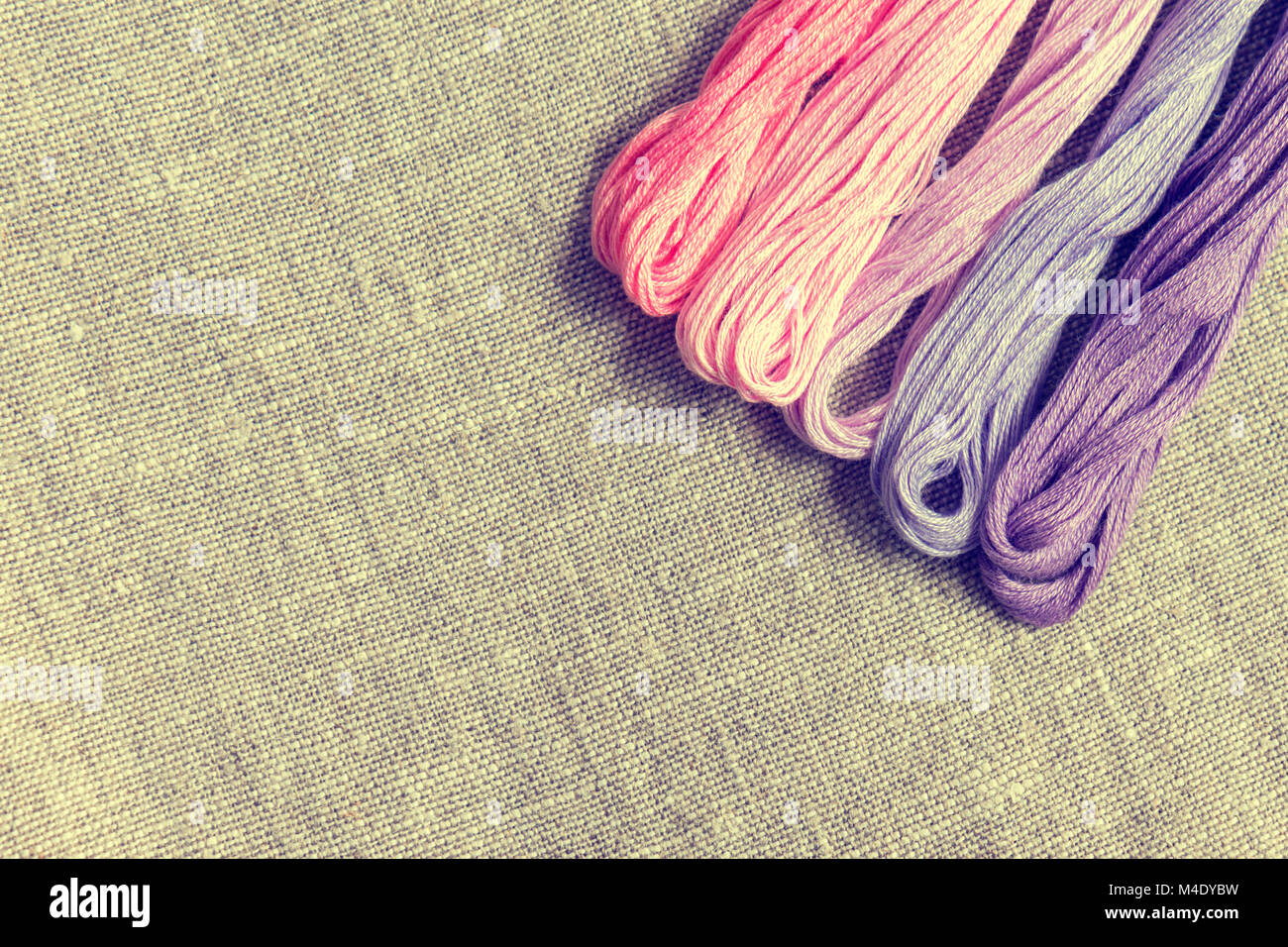 Set for embroidery with thread violet color Stock Photo - Alamy