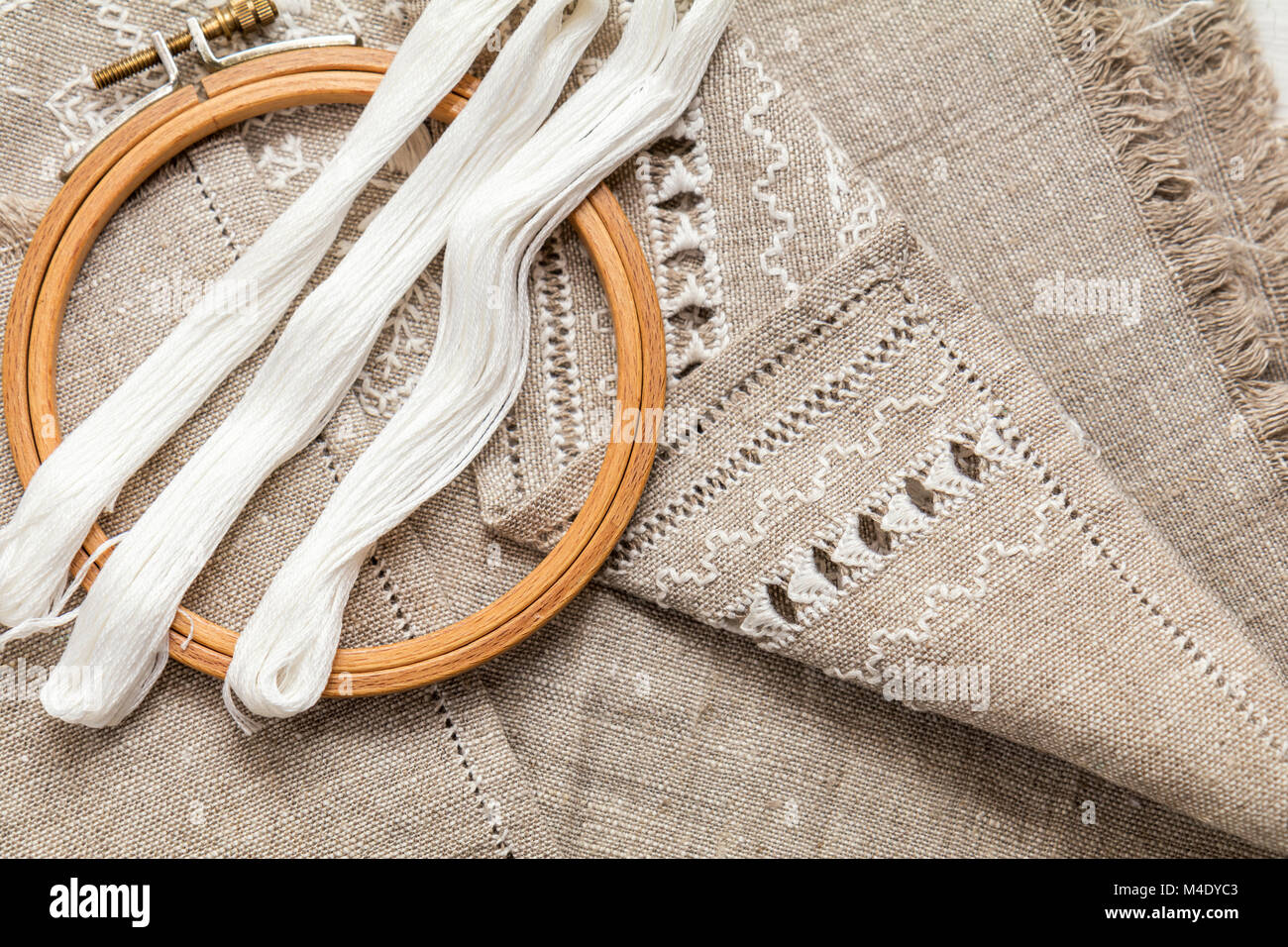 Set for embroidery with thread white color Stock Photo - Alamy