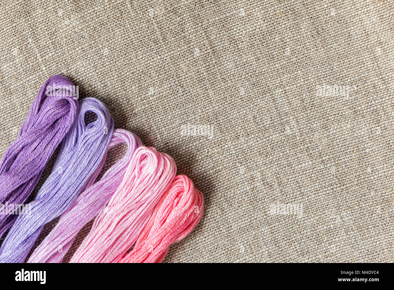 Set for embroidery with thread violet color Stock Photo - Alamy