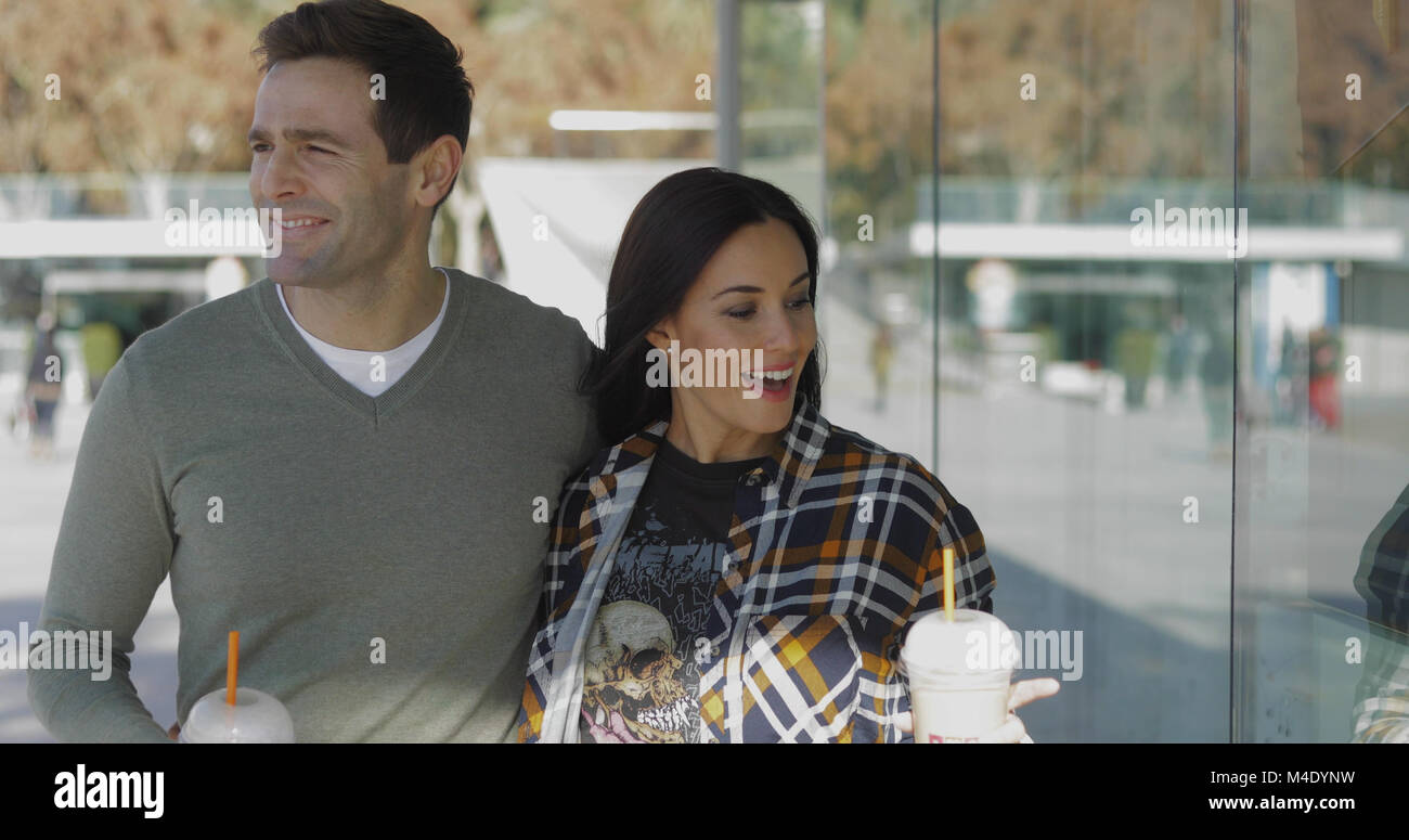 Trendy young woman exclaiming and pointing Stock Photo - Alamy