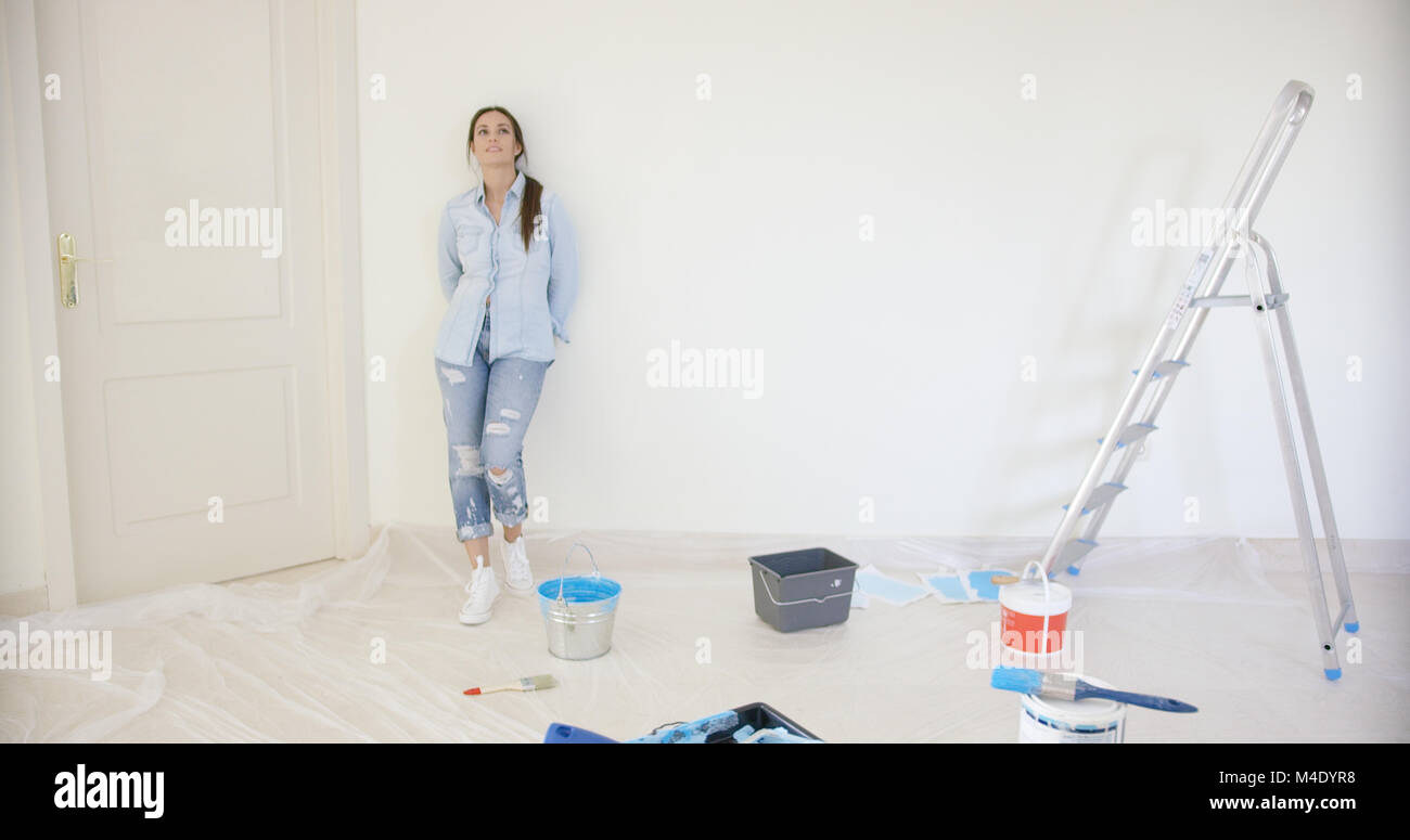 Young woman visualising redecorating her home Stock Photo - Alamy
