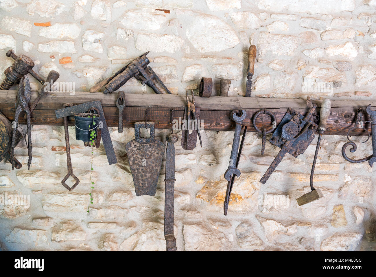Old rusty tools seen in an old workshop Stock Photo - Alamy