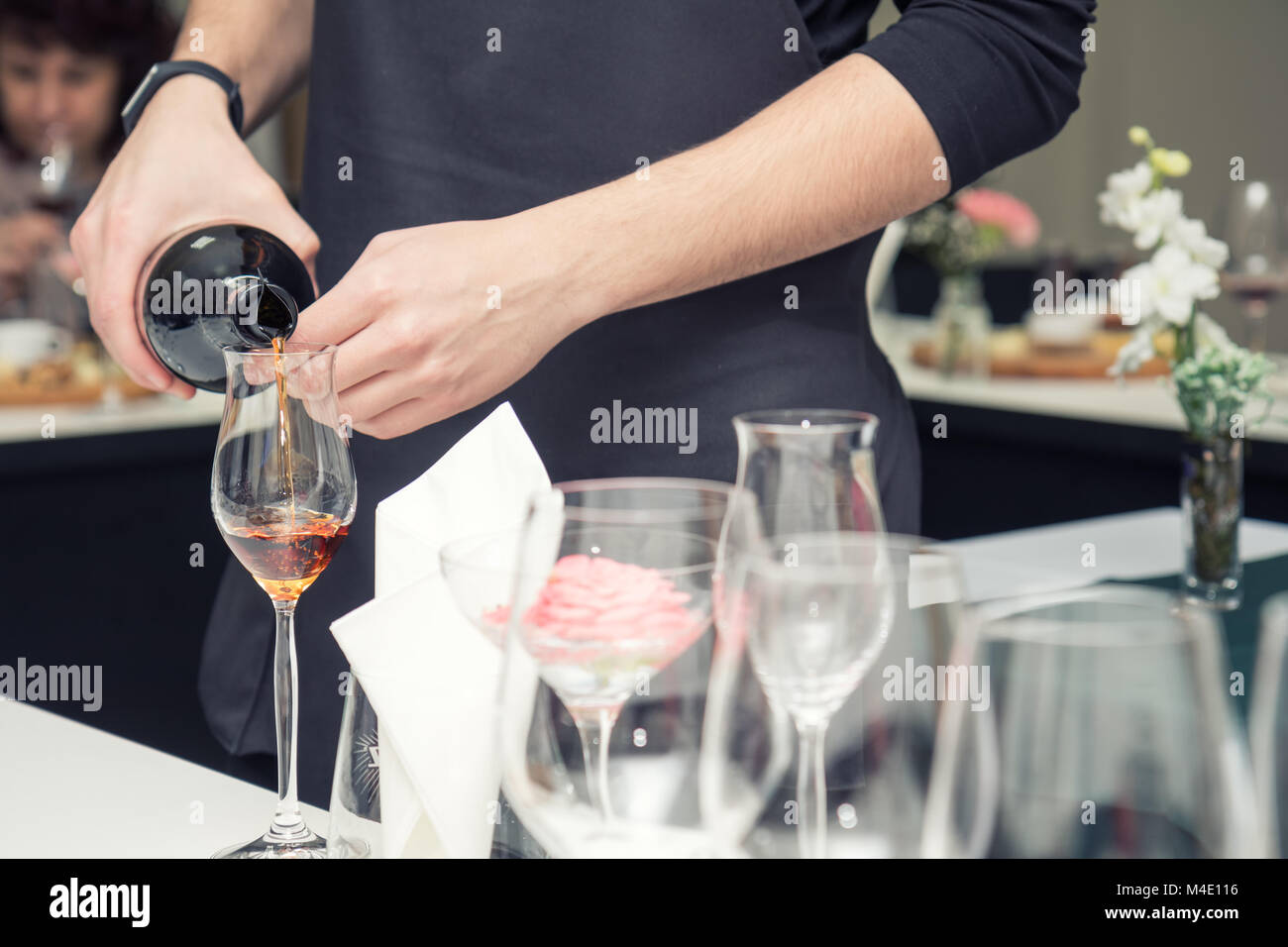 Sommelier pouring wine to the wine glass Stock Photo - Alamy