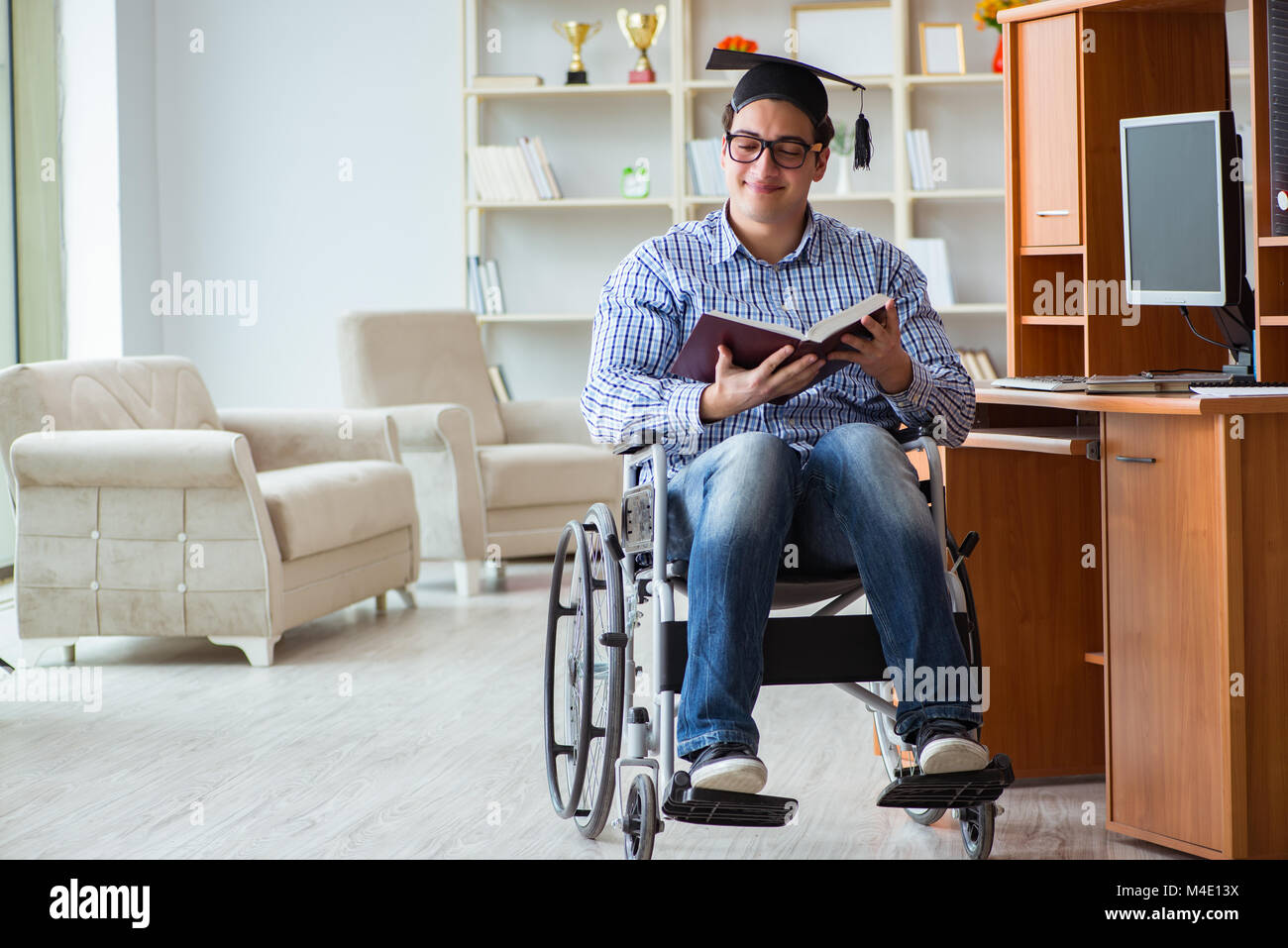 Disabled student studying at home on wheelchair Stock Photo - Alamy