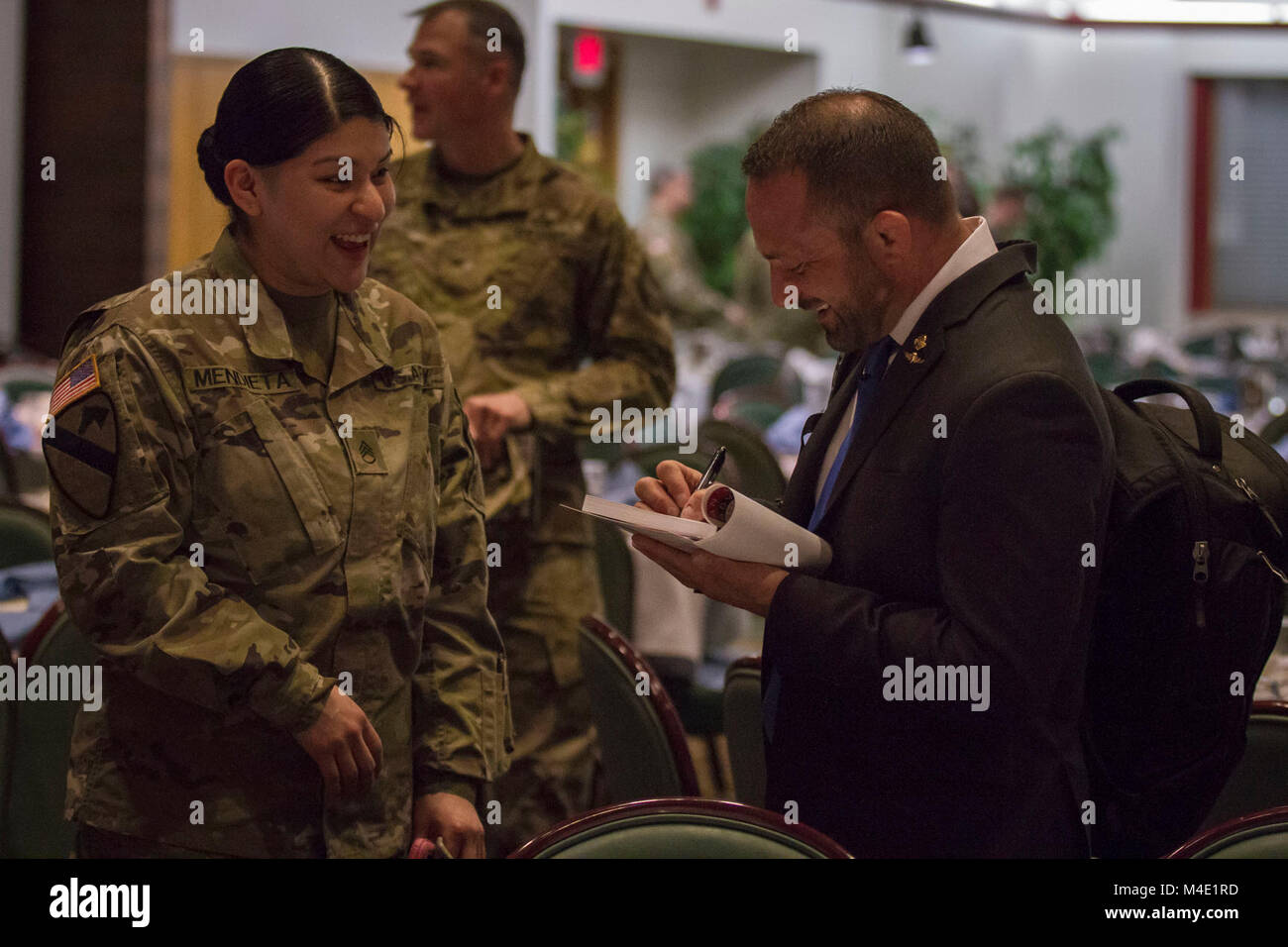 Guest speaker Chad Robichaux greets a Soldier after the conclusion of ...