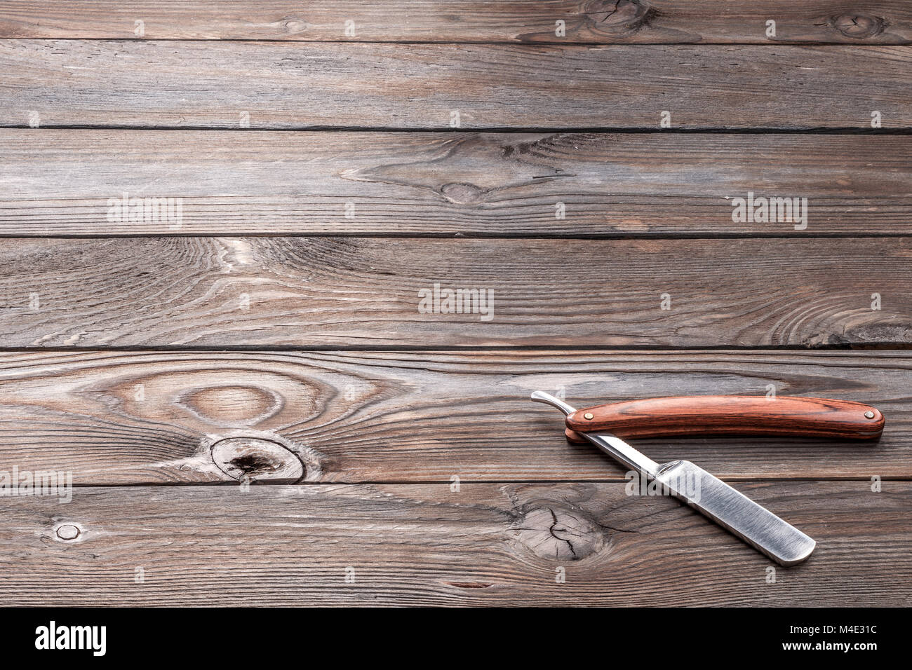 Vintage barber shop straight razor tool on wooden background Stock ...