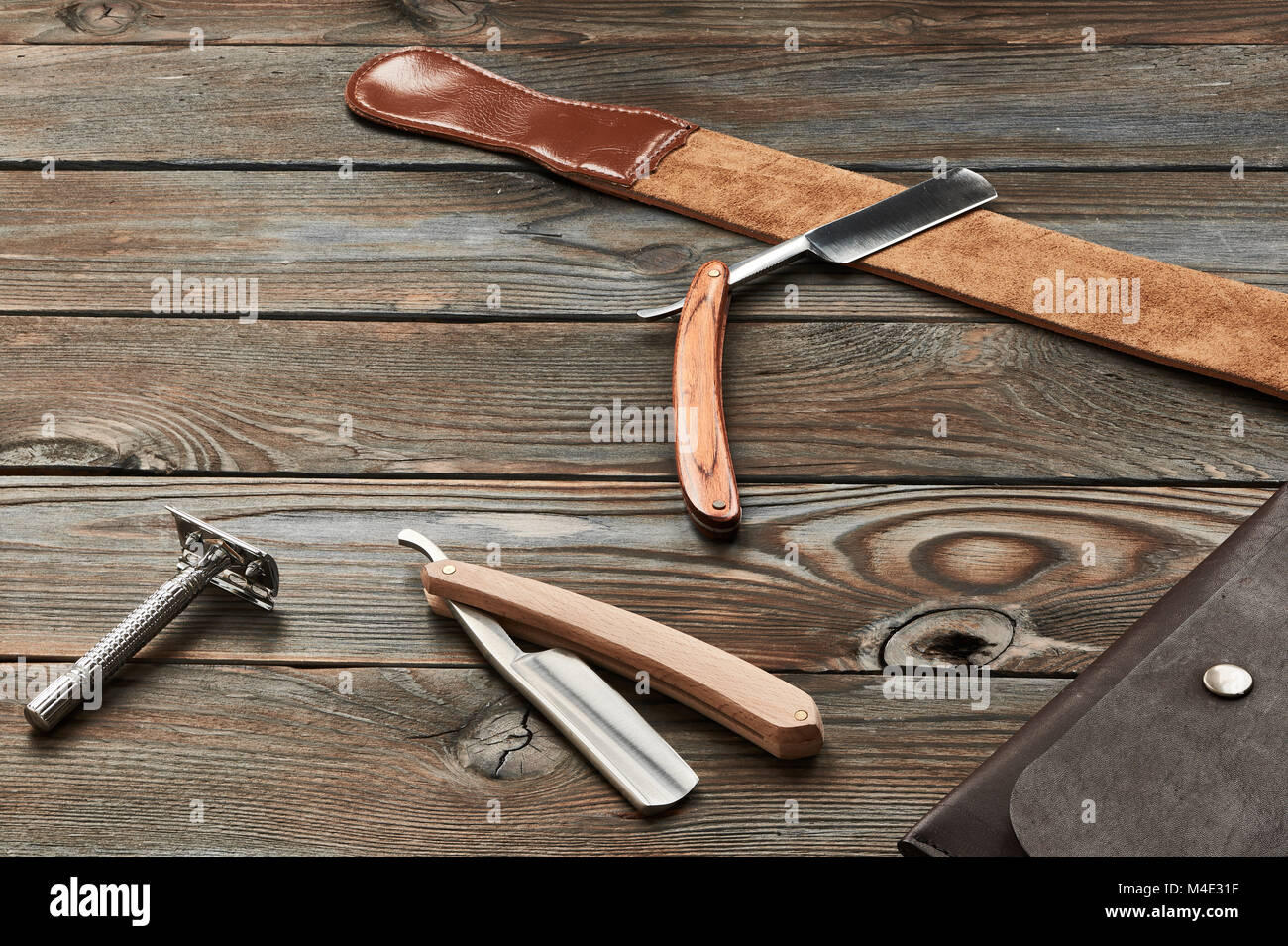 Vintage barber shop razor tools on wooden background Stock Photo - Alamy