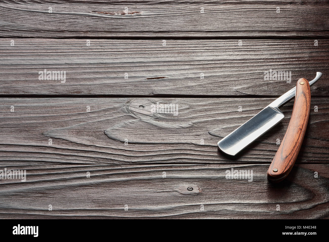 Vintage barber shop straight razor tool on wooden background Stock ...