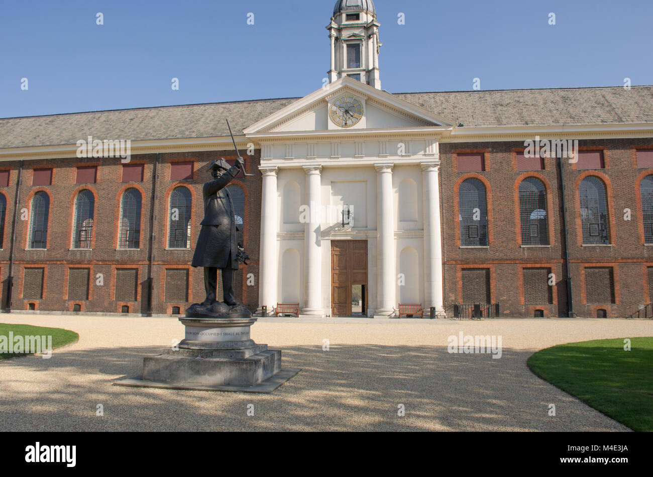 Frontage of Royal Chelsea Hospital with pensioner statue to foreground ...