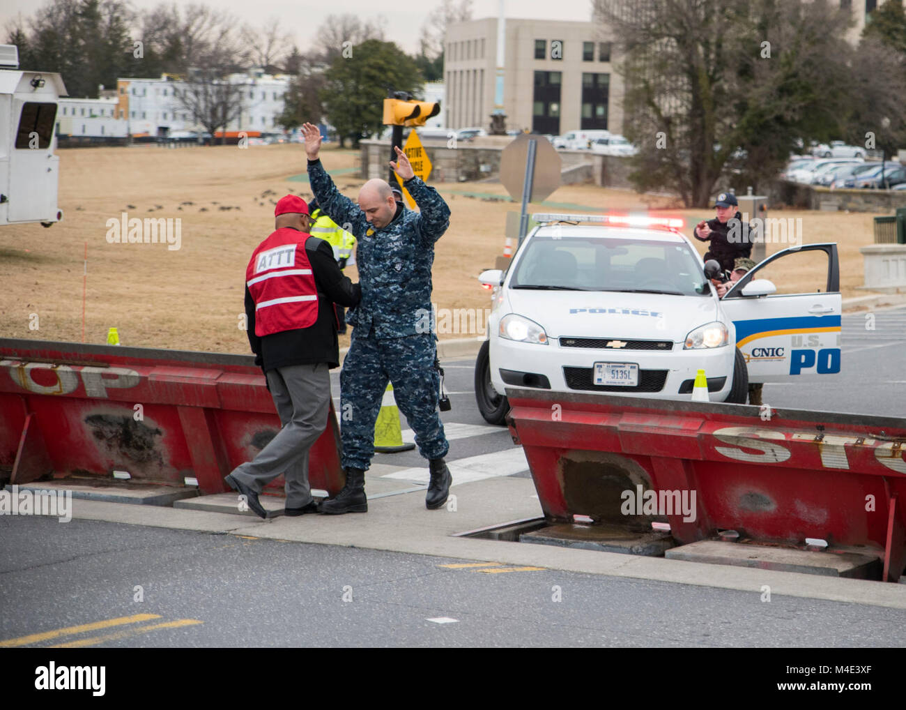 Sailors instruct a gate runner to walk backward during gate runner ...