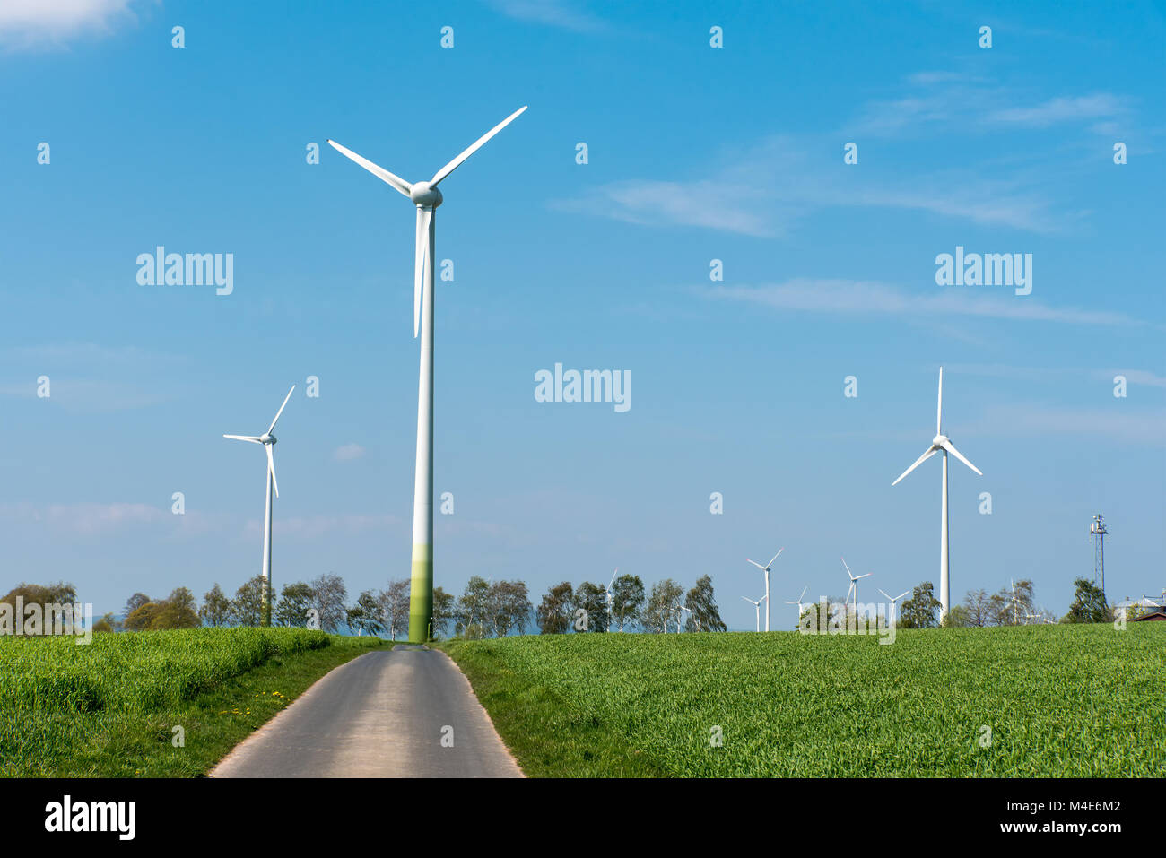 Windwheels and a country road seen in Germany Stock Photo - Alamy