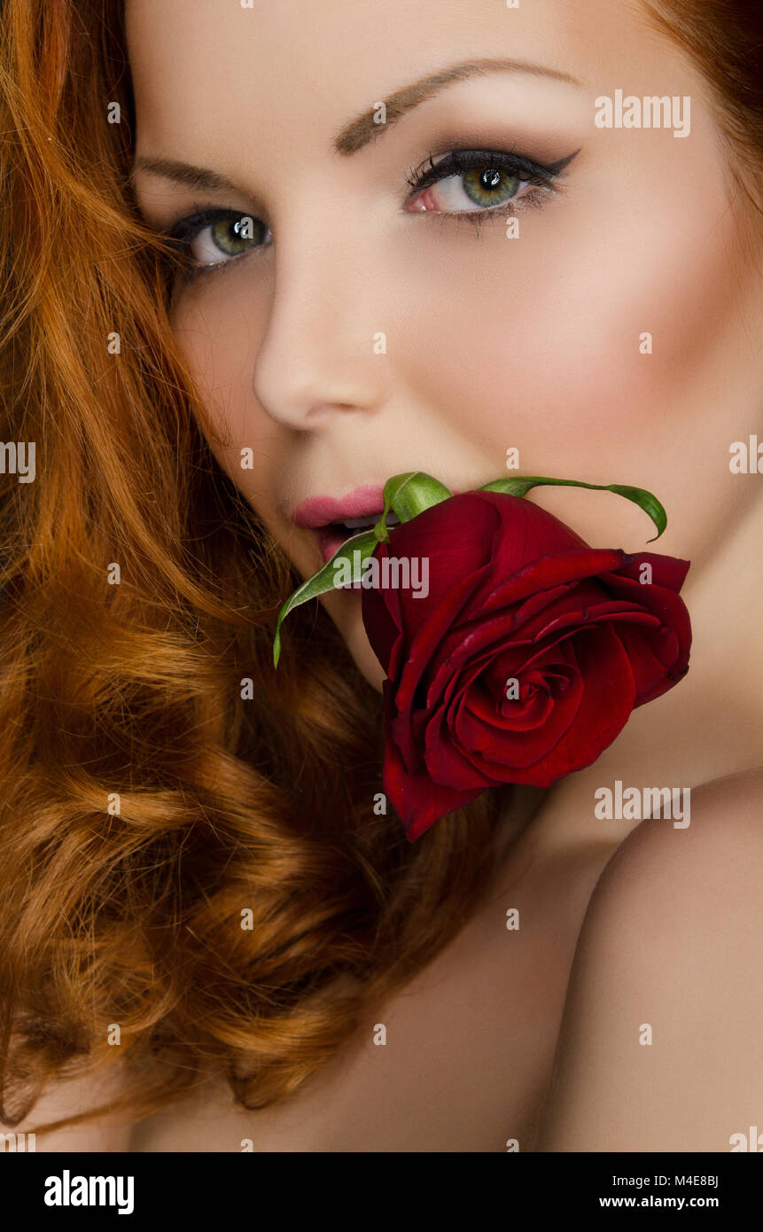 Woman with rose in mouth hi-res stock photography and images - Alamy