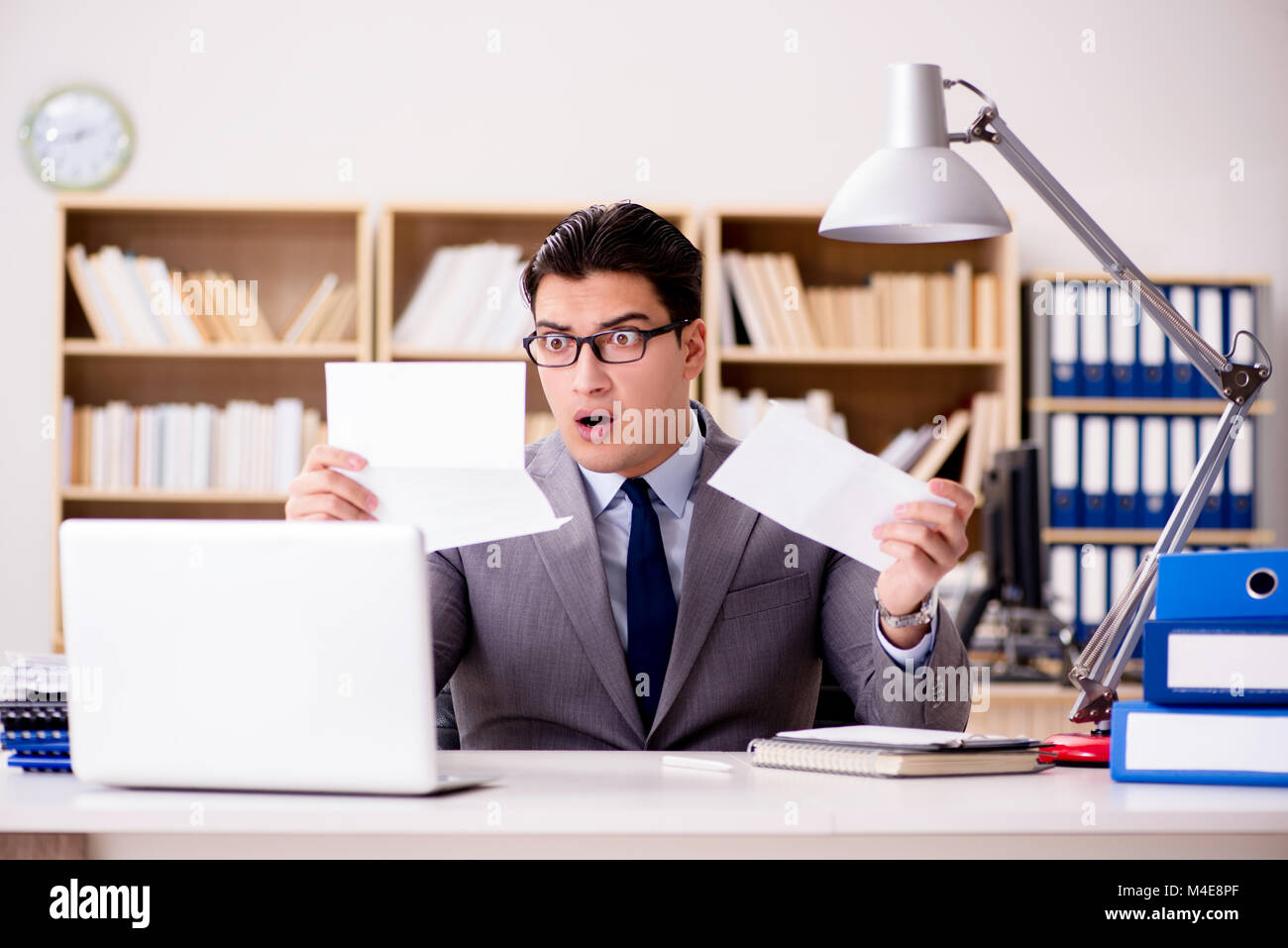 Businessman receiving letter envelope in office Stock Photo - Alamy