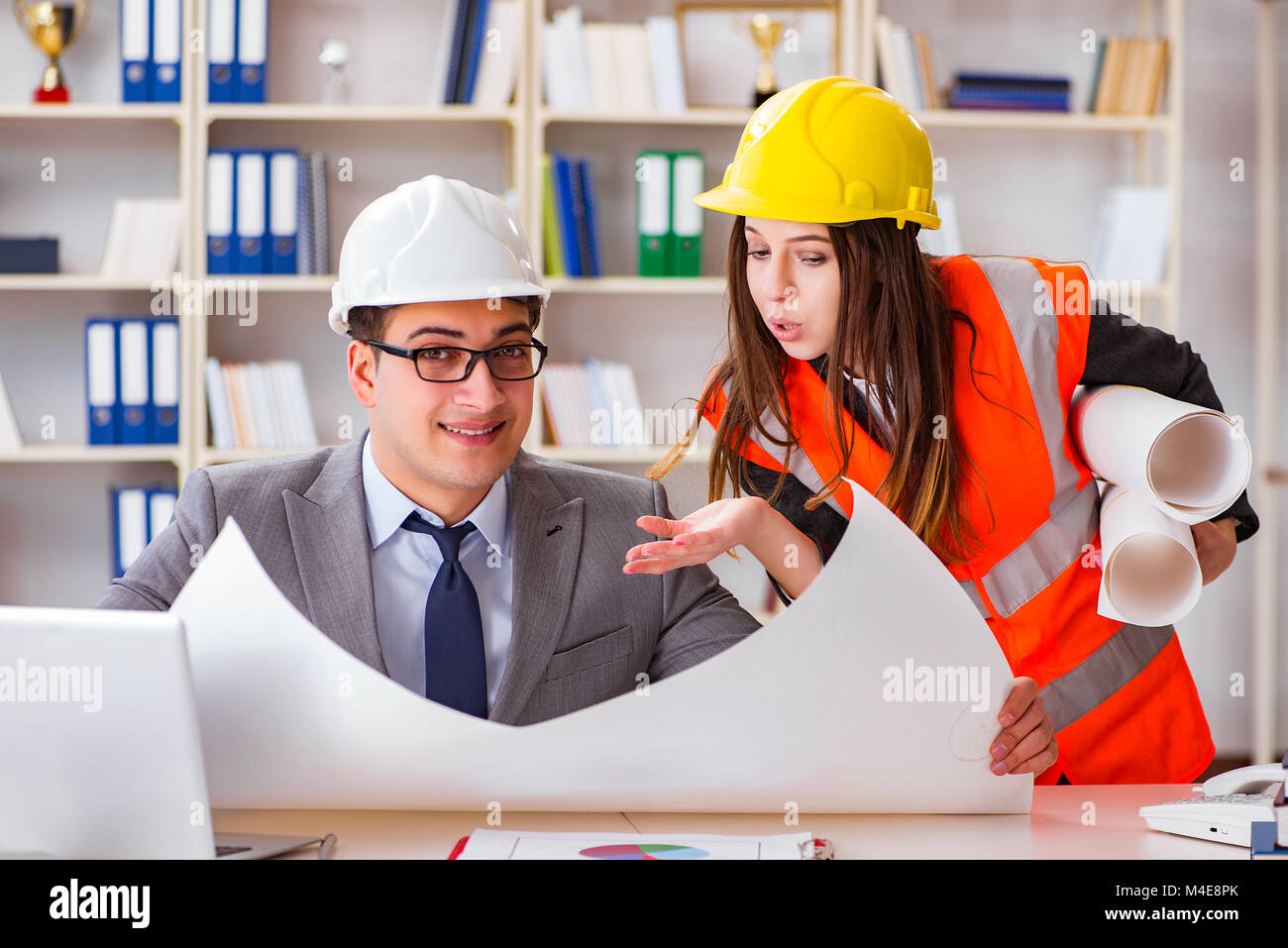 Construction foreman supervisor reviewing drawings Stock Photo - Alamy