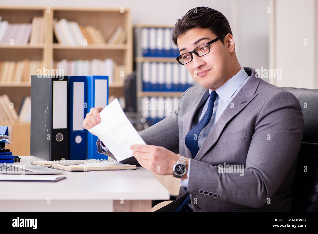 Businessman receiving letter in the office Stock Photo - Alamy