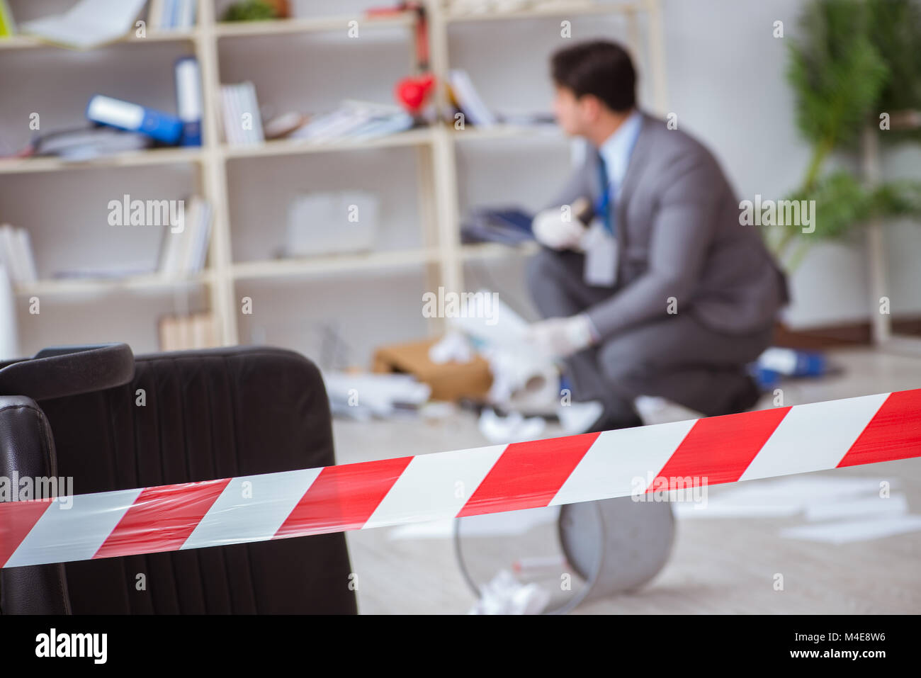 Young man during crime investigation in office Stock Photo - Alamy