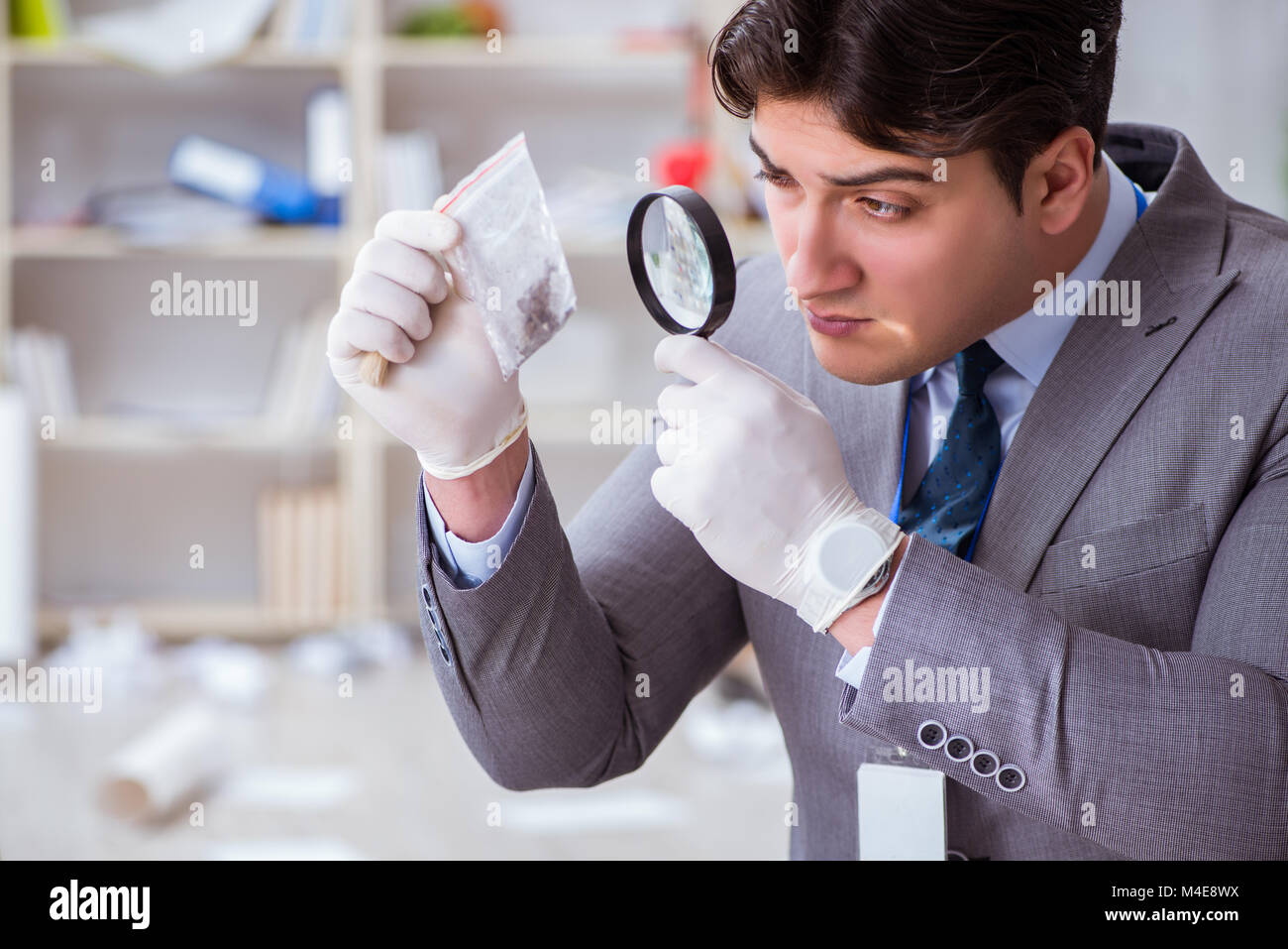 Young man during crime investigation in office Stock Photo - Alamy