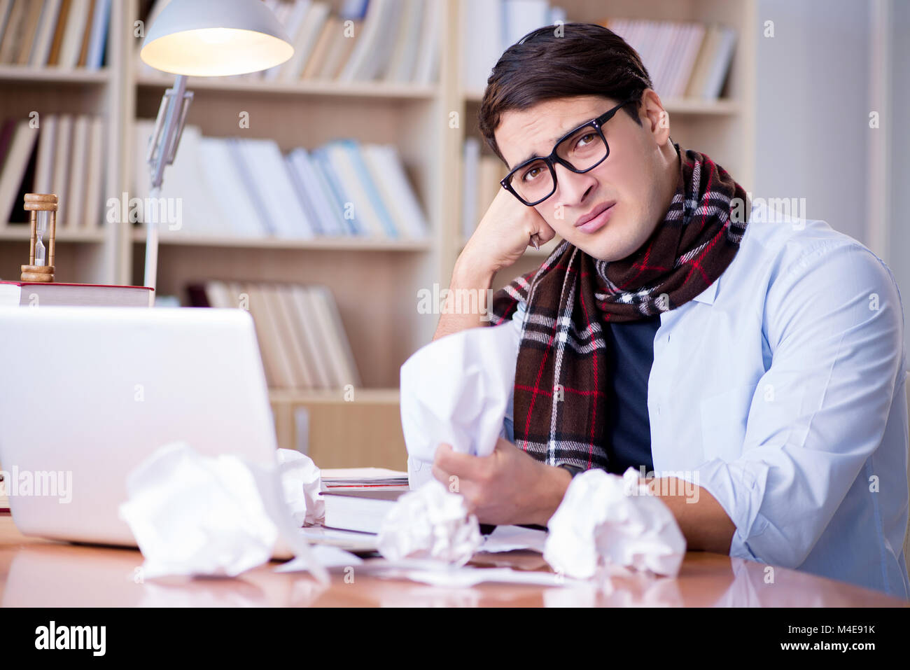 Young writer working in the library Stock Photo - Alamy