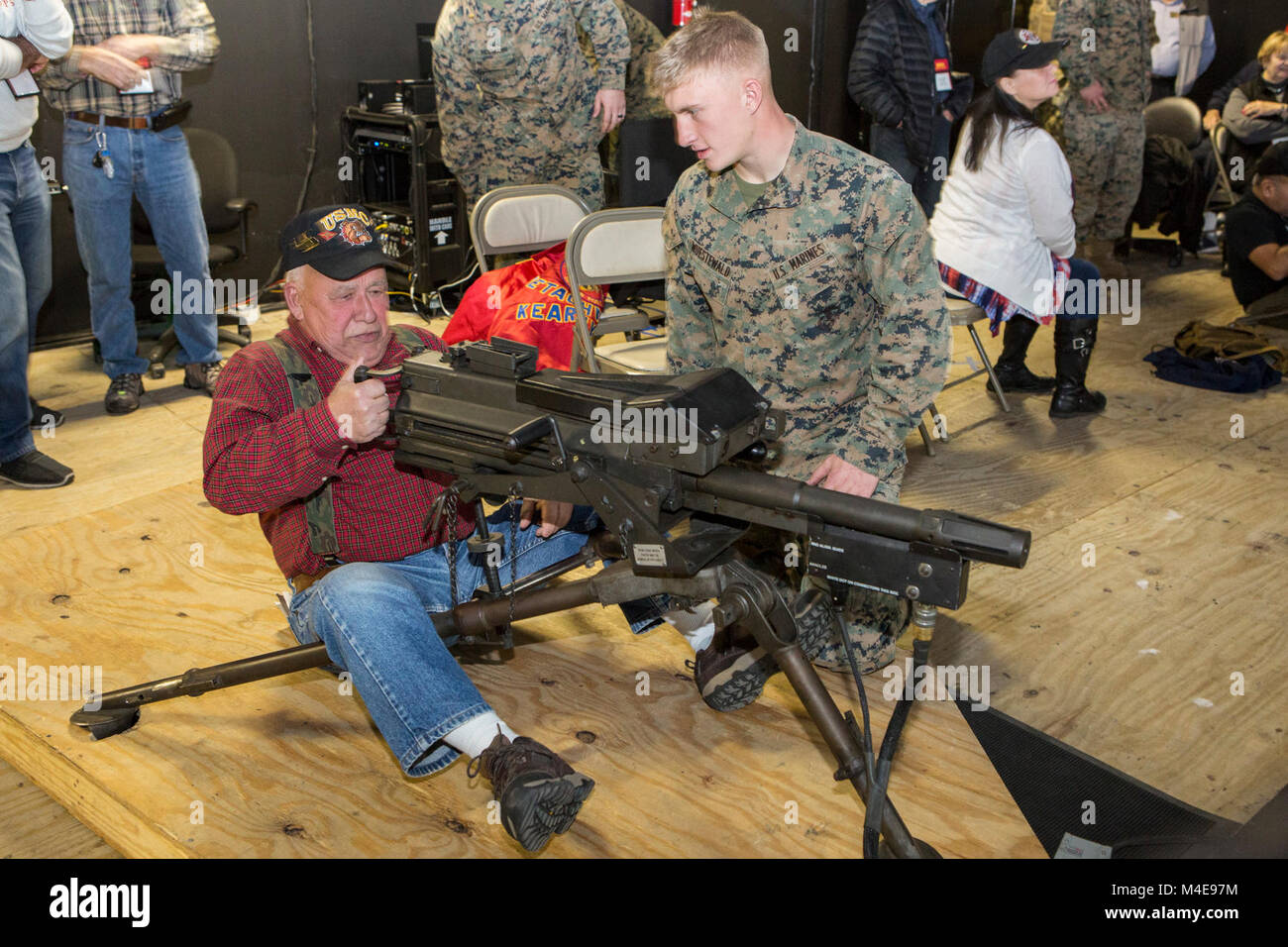 A member of the Second Marine Division Association (SMDA) sights in ...