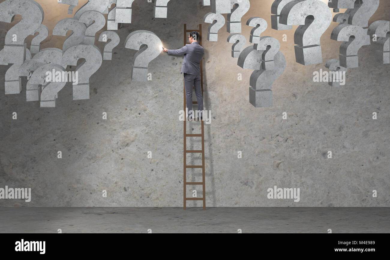 Businessman facing questions in business Stock Photo - Alamy