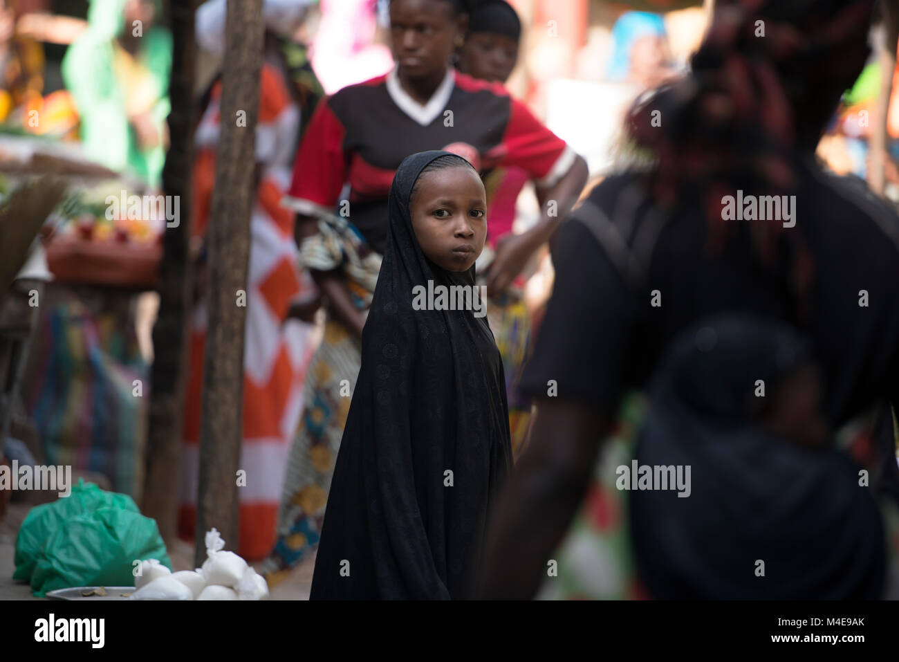 A young ethnic Jola girl at a market place in Senegal, West Africa ...