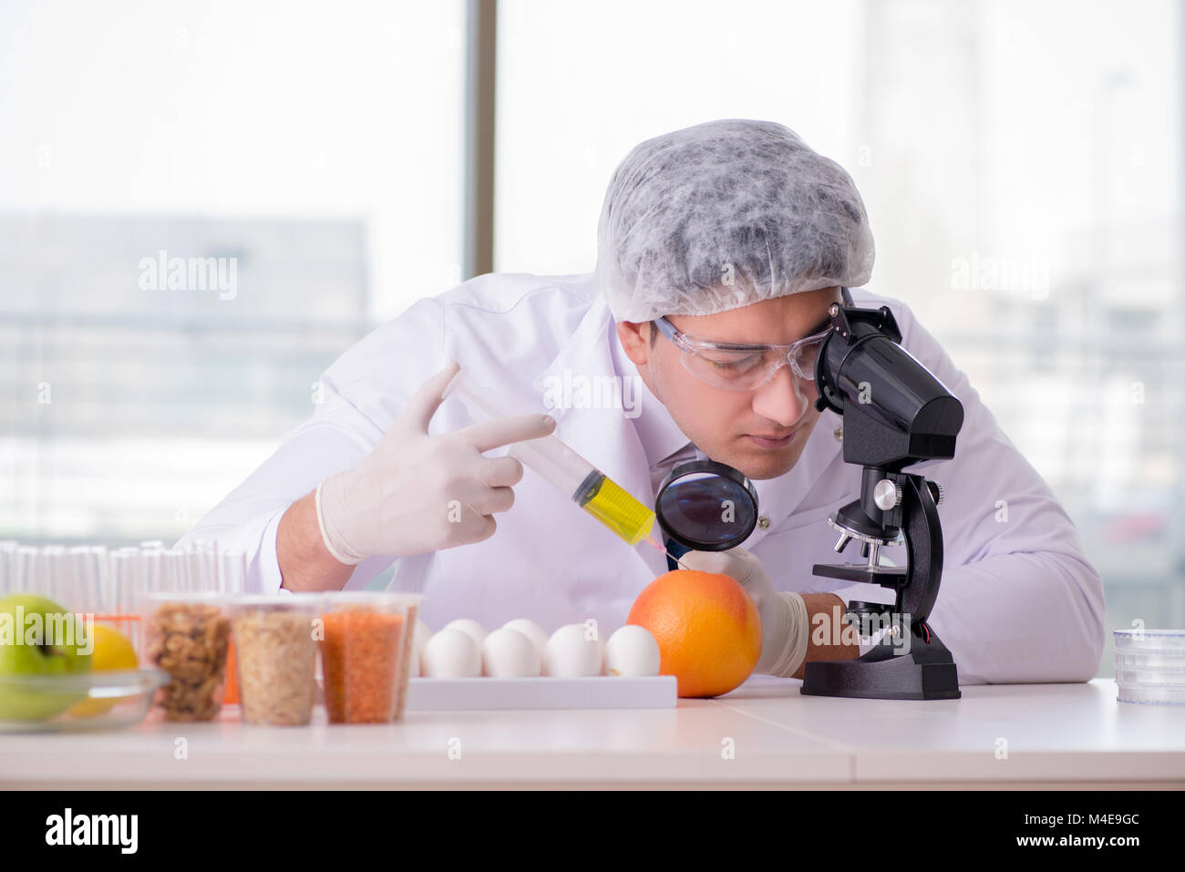 Nutrition expert testing food products in lab Stock Photo - Alamy