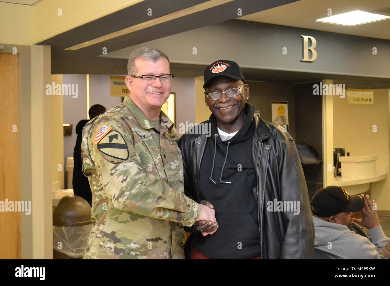 Army Brig. Gen. Mark Simerly, DLA Troop Support commander, shakes hands ...
