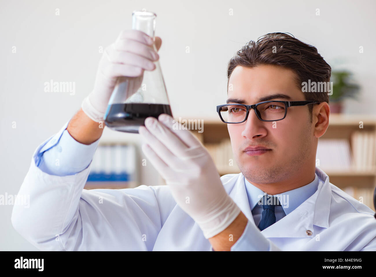 Chemical engineer working on oil samples in lab Stock Photo - Alamy