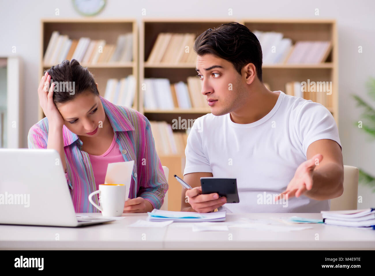 Young family discussing family finances Stock Photo - Alamy