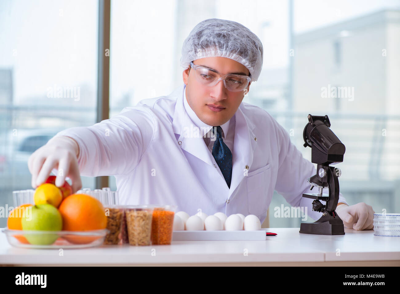 Nutrition expert testing food products in lab Stock Photo - Alamy