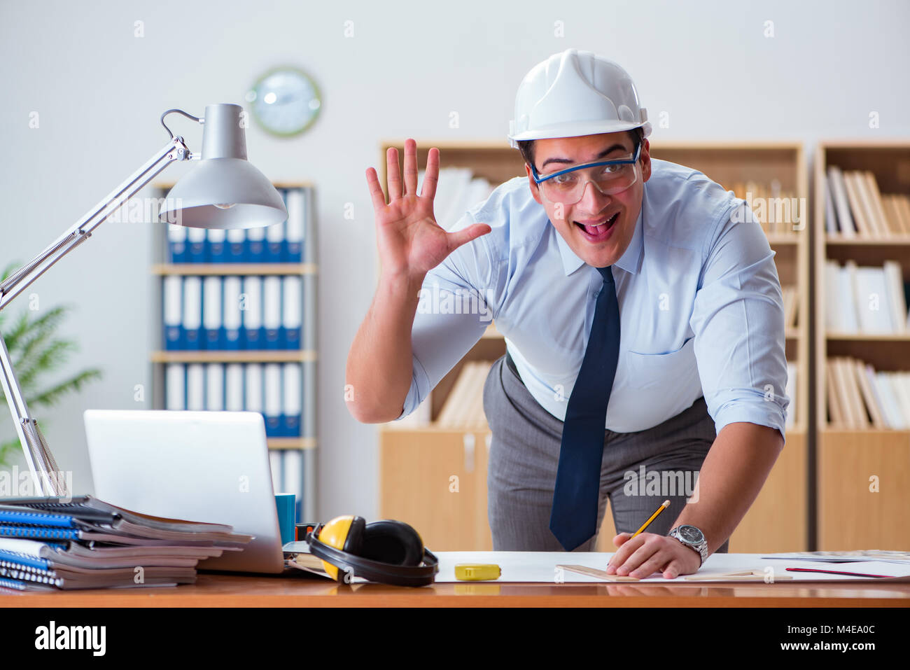 Engineer supervisor working on drawings in the office Stock Photo - Alamy